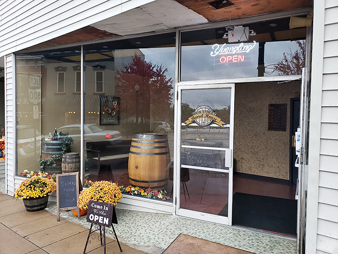 Nothing says "come on in" quite like flowers, a wooden barrel, and that magical neon "OPEN" sign glowing like a beacon for thirsty travelers.
