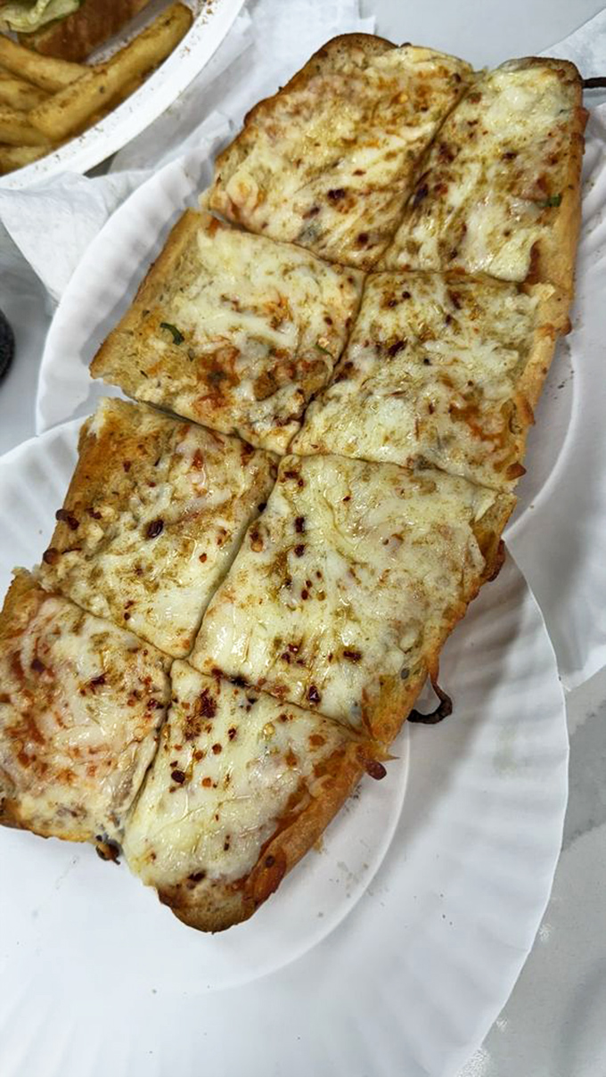 Golden-brown garlic bread that's crispy outside, pillowy inside, and loaded with herbs that'll make your taste buds dance.