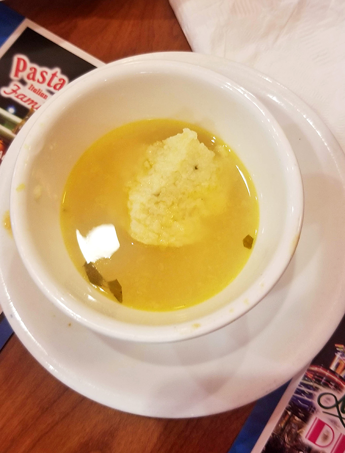 Golden matzo ball soup that would make any grandmother nod in approval&mdash;floating like a delicious dumpling planet in a savory solar system.