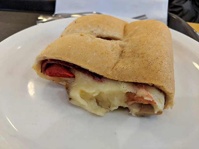 A proper stromboli should ooze cheese like this one&mdash;the kind of sandwich that requires both hands and zero shame.