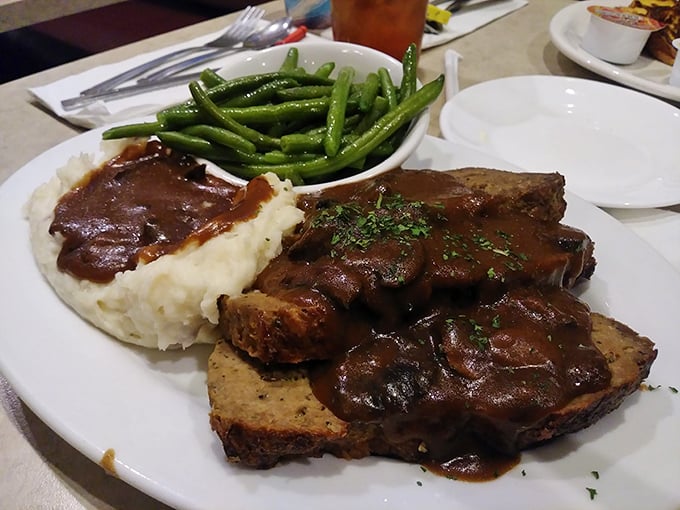 Meatloaf that would make your grandmother jealous, swimming in rich gravy alongside mashed potatoes and green beans. Comfort food that hugs your soul.