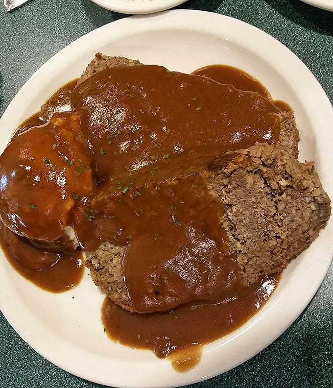 This meatloaf isn't just covered in gravy&mdash;it's swimming in a pool of savory goodness that would make grandmothers everywhere nod in approval.