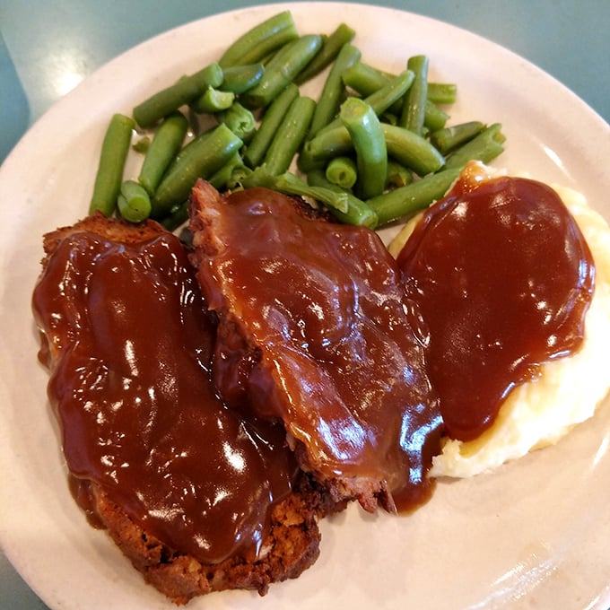 The meatloaf dinner with its glistening gravy and vibrant green beans proves that sometimes the classics don't need reinvention—just respect and proper execution.