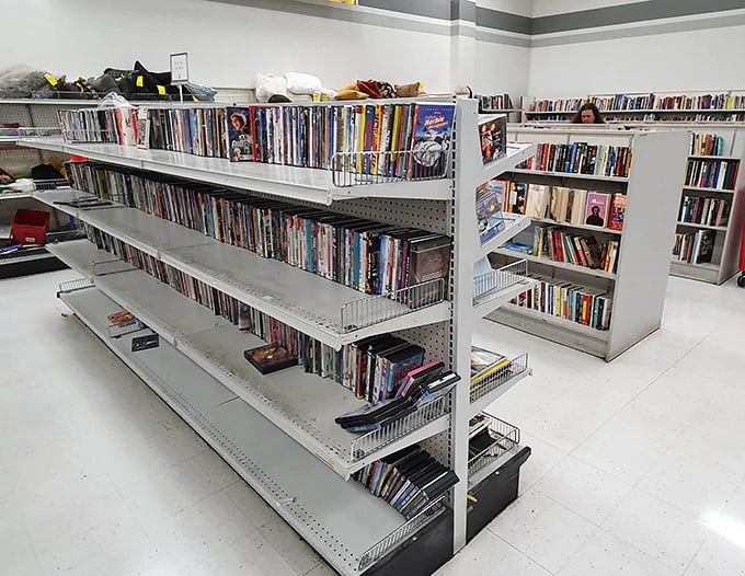 
Board games with all their pieces (mostly) and DVDs of movies you forgot you loved. The media section is Netflix before streaming, waiting on shelves instead of servers.