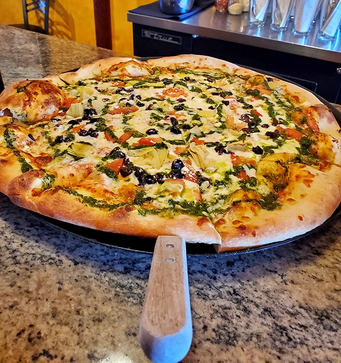 Pizza perfection that would make an Italian grandmother weep with joy. Those bubbling edges tell you someone back there actually cares about dough.