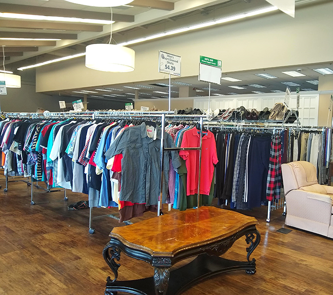 That antique coffee table surrounded by men's shirts tells the whole Goodwill story&mdash;unexpected elegance amid everyday necessities, all at remarkable prices.