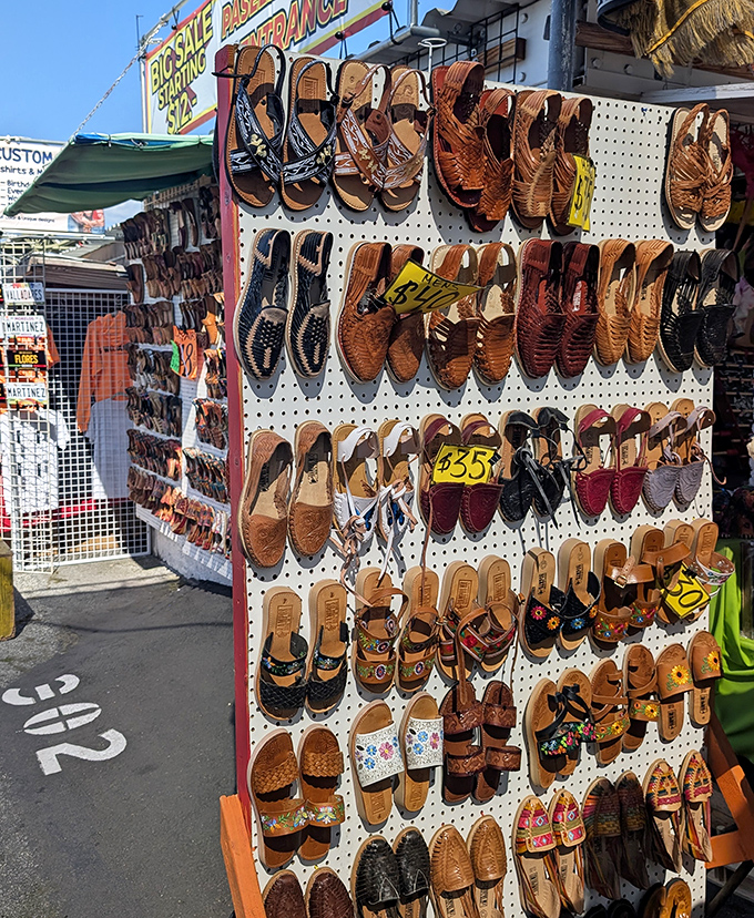 Traditional Mexican sandals lined up like leather rainbows, comfortable enough to wear while browsing these endless aisles.