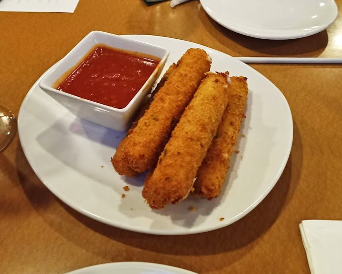 Mozzarella sticks done right: crispy exterior giving way to that perfect cheese pull that deserves its own slow-motion sequence in a food documentary.