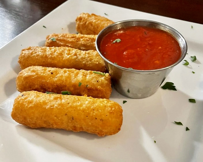 Mozzarella sticks that shatter with purpose, revealing that perfect cheese pull moment that food photographers dream about. Dunk with abandon.