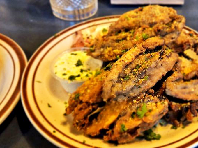 Fried mushroom planks dusted with what appears to be their famous "Magic Dust"&mdash;vegetarian food that makes carnivores jealous.