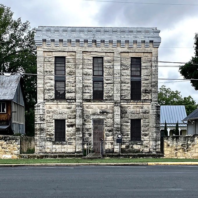 The Old Jail looks like it could still keep outlaws in line&mdash;a limestone testament to frontier justice with windows that don't invite lingering.