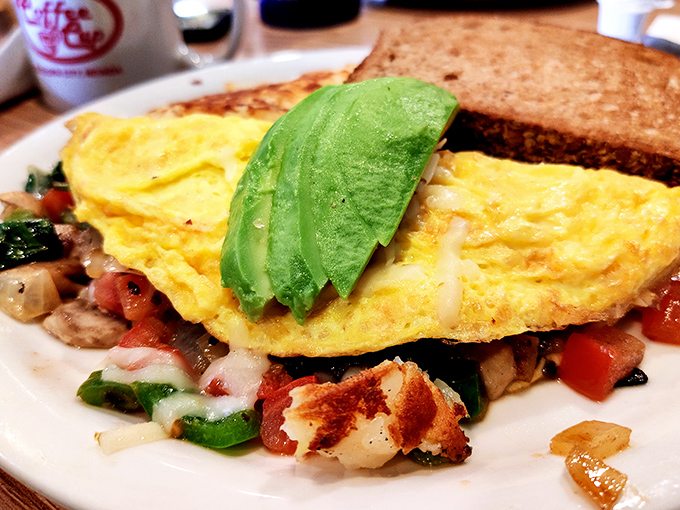 An omelet that doesn't just feed you, it hugs you from the inside &ndash; fresh veggies, melty cheese, and that perfect avocado crown.