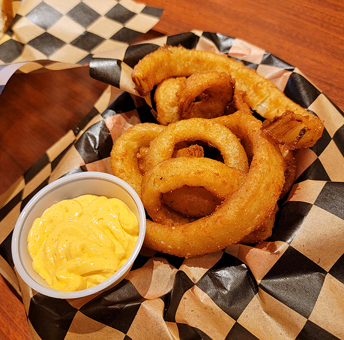 Onion rings so perfectly crisp they make that satisfying crunch sound that's basically nature's way of saying "this is going to be good."