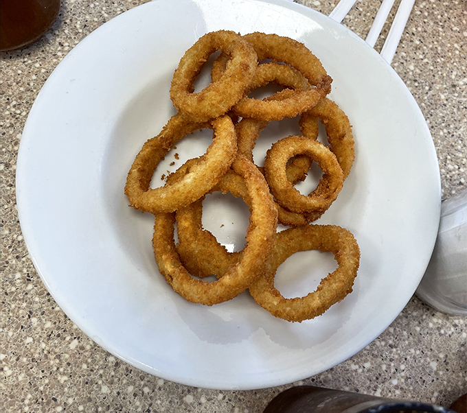 Onion rings that shatter with satisfying crispness&mdash;the perfect golden halos that make you wonder why anyone bothers with those fancy appetizers elsewhere.