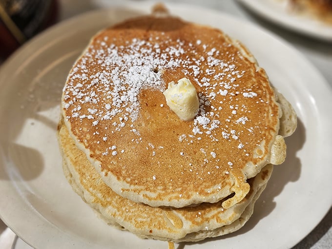 These pancakes aren't just breakfast, they're edible pillows of joy &ndash; the butter melting into that perfect golden surface like a warm hug for your taste buds.