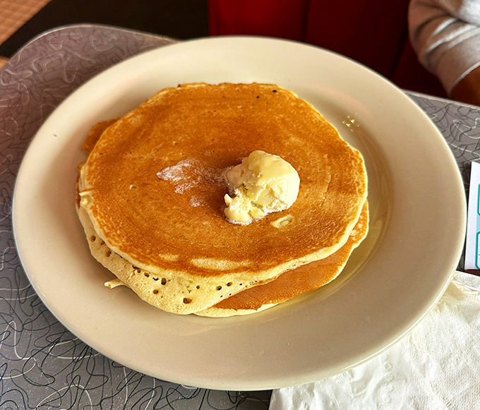 Golden pancakes with melting butter&mdash;the simple perfection that makes you question why anyone would ever skip breakfast.