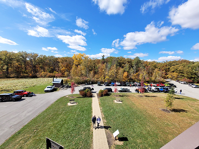 From this bird's-eye view, the fall-painted parking area looks like the world's most beautiful waiting room for nature's grand performance.