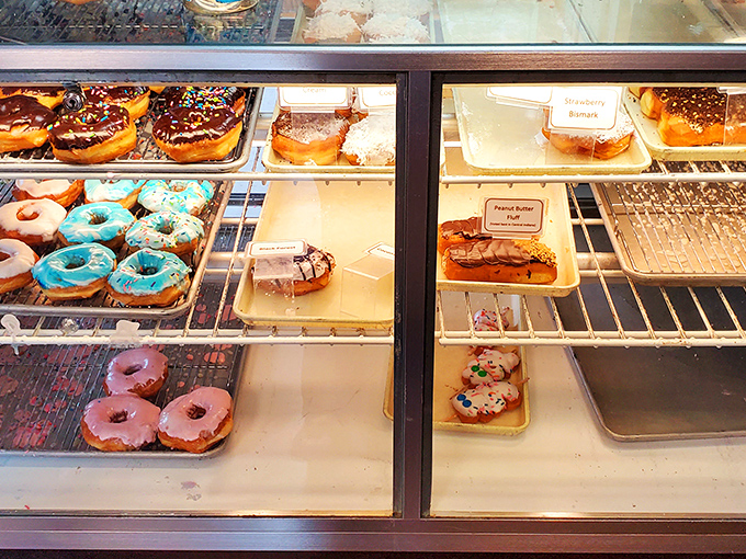 The display case: where diet plans go to die and "I'll just have one" becomes the lie you tell yourself.