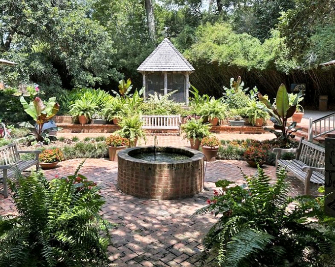 Garden geometry at its finest. The circular brick pattern creates a perfect orbit around the fountain, like a planetary system of plants.