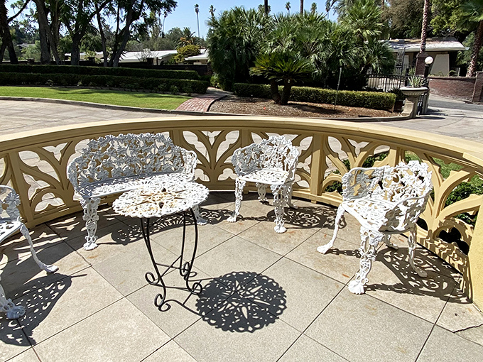 Victorian-era outdoor furniture that somehow looks both impossibly uncomfortable and absolutely worth sitting in for the Instagram moment.