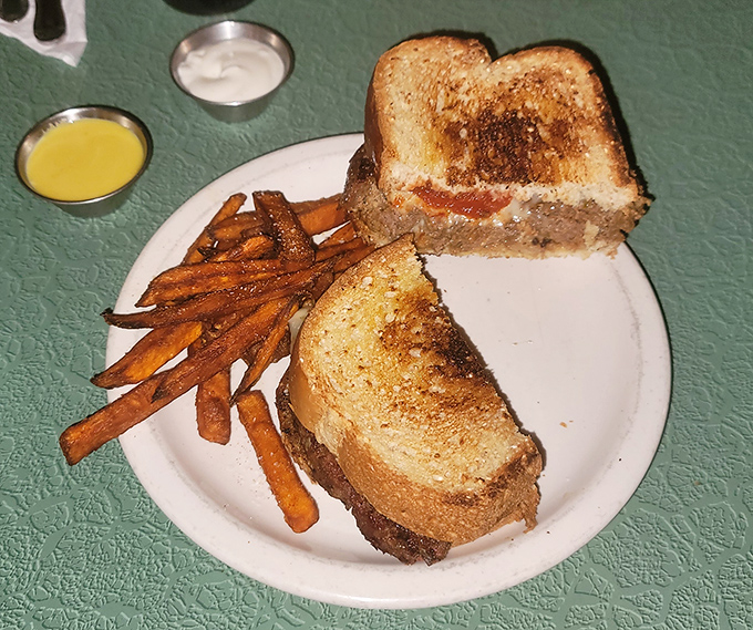 This patty melt with sweet potato fries isn't just a sandwich; it's a warm hug on a plate after a long day.