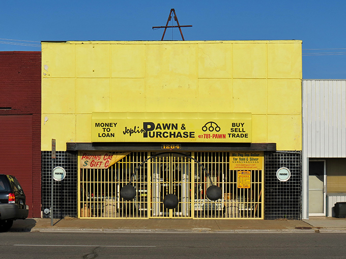 Joplin Pawn & Purchase&mdash;where one person's "I shouldn't have bought this" becomes another's treasure. The bright yellow exterior is like a caution sign for your budget.