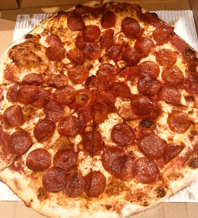 The pepperoni pizza that launched a thousand cravings. Each perfectly curled, crisp-edged pepperoni cup holds a tiny pool of delicious possibility.