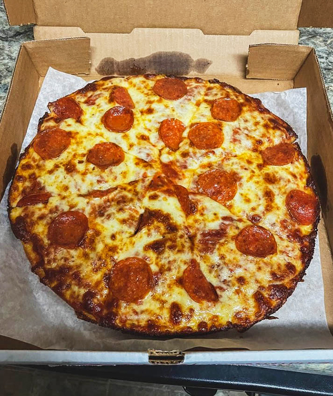 Luigi's pepperoni pizza doesn't just have cheese &ndash; it has a magnificent blanket of it, with pepperoni discs that curl into perfect little flavor cups.