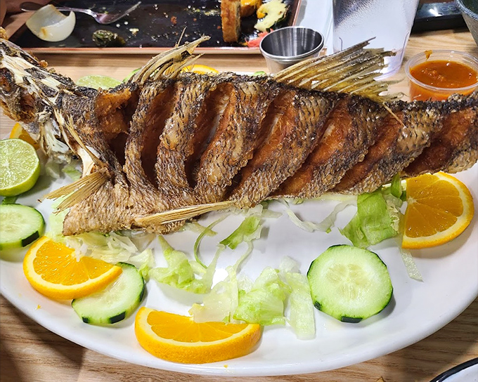This whole fried fish stares back at you as if to say, "Yes, I'm delicious and I know it." Crispy exterior, tender flesh, and zero regrets.