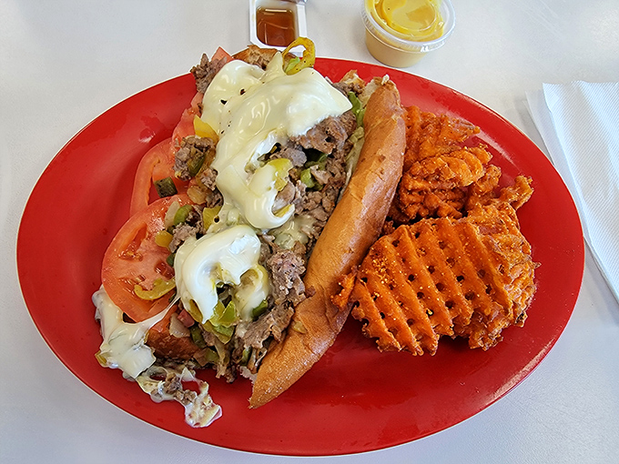 A proper Philly cheesesteak that doesn't need Philadelphia's permission&mdash;just melty cheese, tender beef, and those waffle fries playing a perfect supporting role.