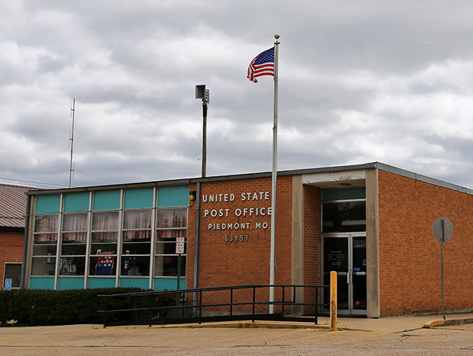 The post office – where small-town news travels faster outside the building than any letter could inside it.