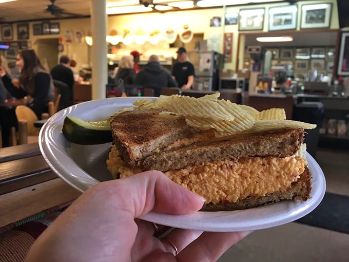 The humble sandwich elevated to art form&mdash;crispy toast, generous filling, and those ridged potato chips that snap with each bite.