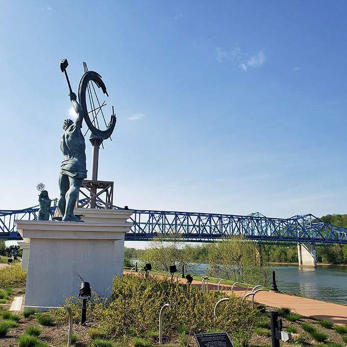 This riverside sculpture dramatically gestures toward the Ohio River bridge, as if saying "Look what we built!" with appropriate artistic flair.