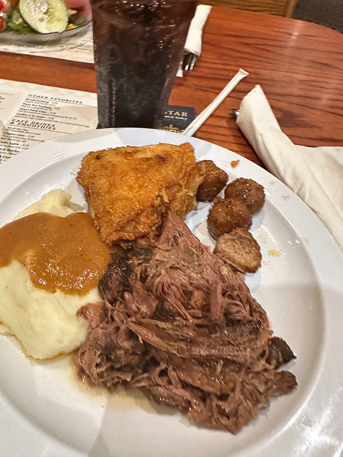 The pot roast platter &ndash; where tender meat, mashed potatoes, and gravy come together in a holy trinity of comfort.
