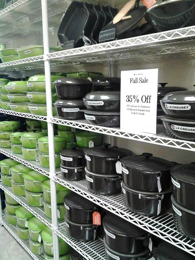 Le Creuset cookware in signature green and black. Kitchen status symbols at outlet prices&mdash;because your bolognese deserves a proper home.