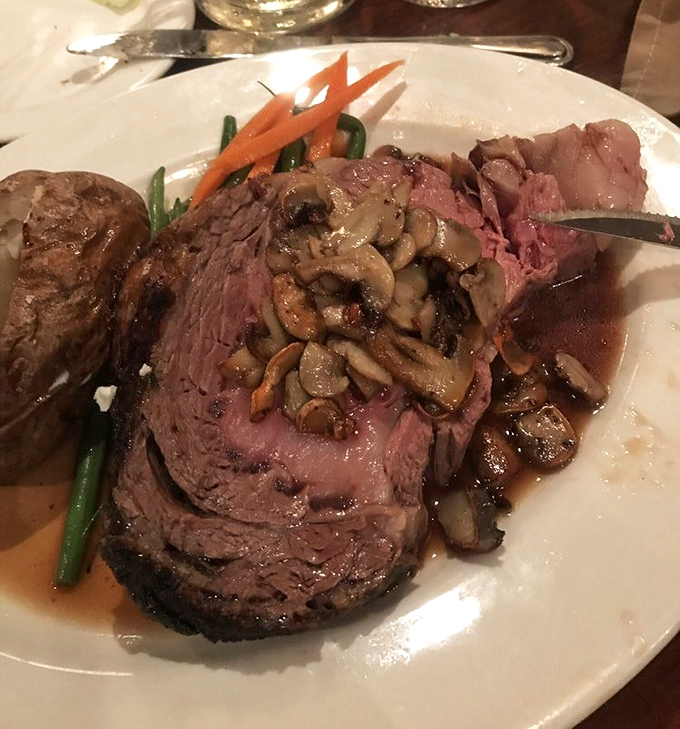 Prime rib that's been slow-roasted to pink perfection, topped with sautéed mushrooms and served with seasonal vegetables that know their supporting role.