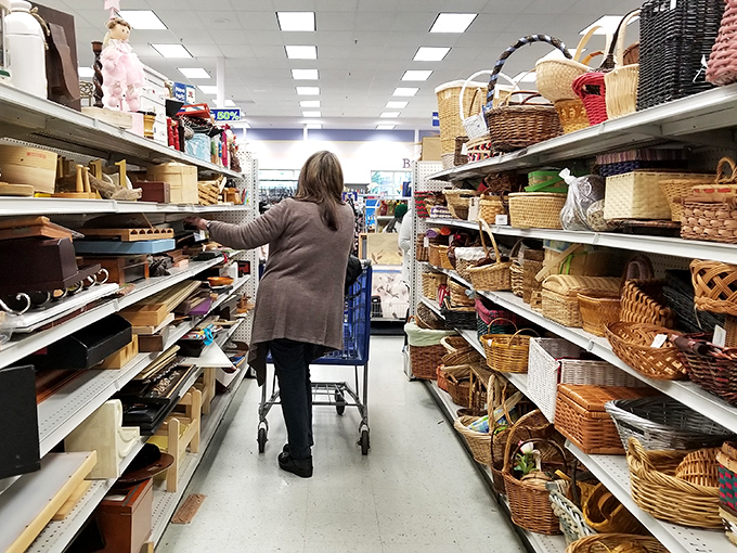 A shopper navigates the basket bonanza &ndash; wicker wonderland on the right, wooden treasures on the left. Marie Kondo would have a field day.