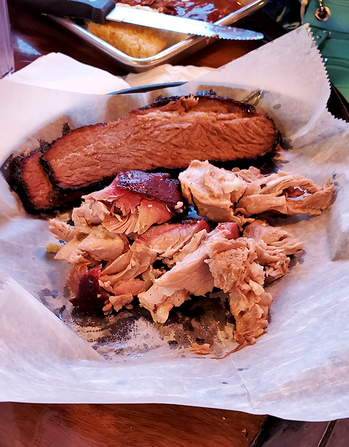 Behold the holy grail&mdash;pulled pork and brisket sharing butcher paper real estate in a meat medley that makes vegetarians question their life choices.