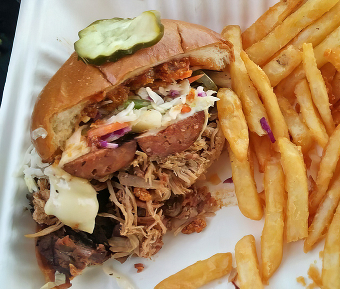This pulled pork sandwich isn't just a meal, it's a commitment to happiness. Tender strands of smoky pork spill out from a perfectly toasted bun, with coleslaw adding that essential crunch.