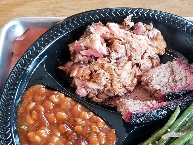 A barbecue platter that belongs in the Louvre. The pink smoke ring on that brisket is what pitmasters dream about at night.