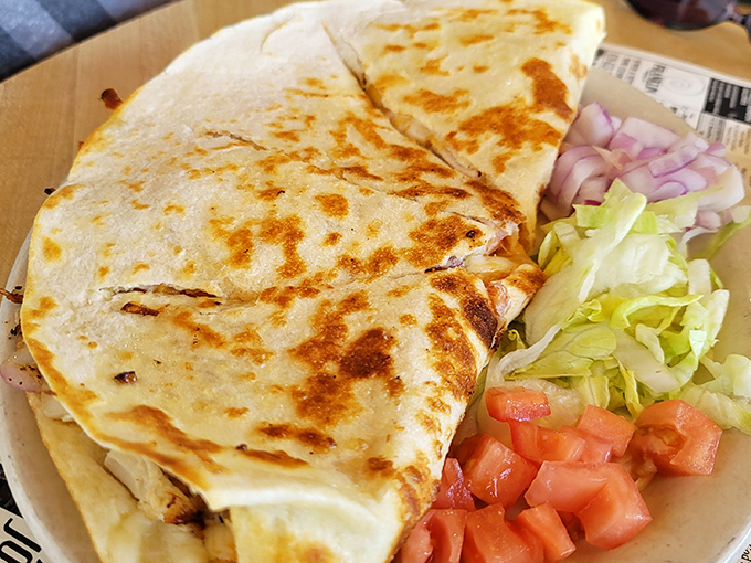 A quesadilla bronzed to perfection, flanked by fresh veggies &ndash; the kind of honest bar food that makes you cancel your dinner reservations elsewhere.