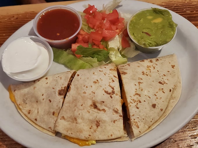 The quesadilla that launched a thousand cravings. Simple, honest food with the holy trinity of accompaniments: salsa, sour cream, and guacamole.