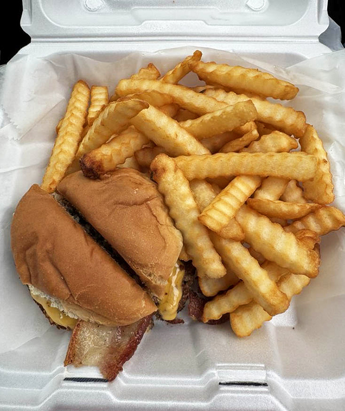 The Razorback burger with crinkle-cut fries &ndash; a plate that screams "Arkansas comfort food" louder than a Hogs football crowd.