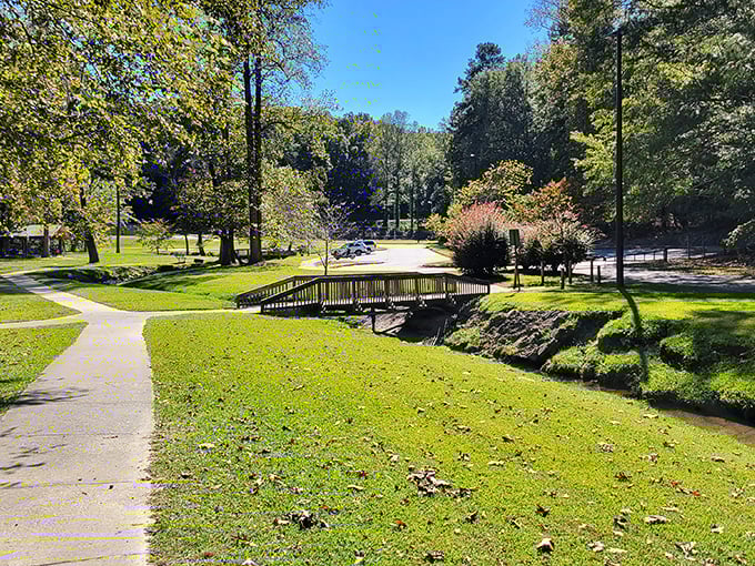 A wooden footbridge over gentle waters&mdash;the kind of spot where you suddenly remember what "peaceful" actually feels like.