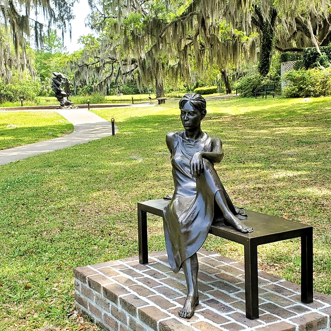 Even bronze needs a break sometimes. This contemplative sculpture captures a moment of quiet grace amid Brookgreen's lush landscape.