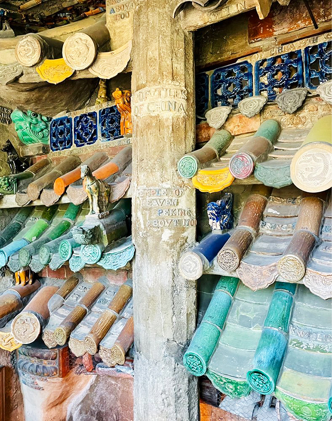 Ceramic treasures embedded in concrete walls &ndash; like someone raided a global tile shop and thought, "Why choose when you can use them all?"