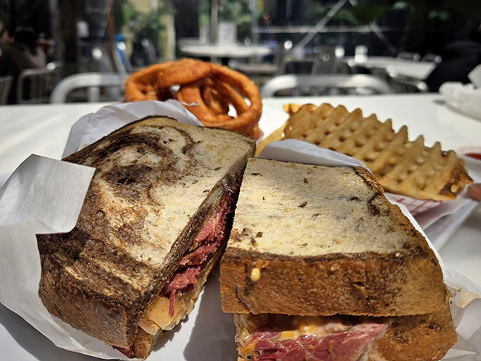 The Reuben: where pastrami, sauerkraut, and Russian dressing perform a three-part harmony that would make Beethoven weep with joy.