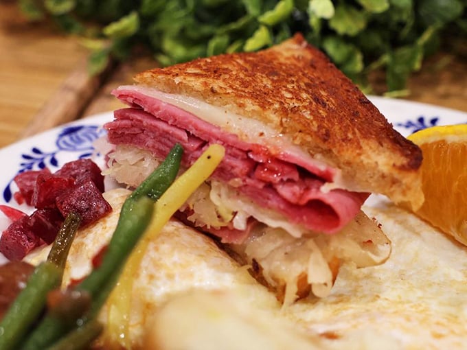 This Reuben sandwich, layered with tender corned beef and sauerkraut, represents the beautiful cultural fusion that is Wisconsin's Scandinavian-American heritage.