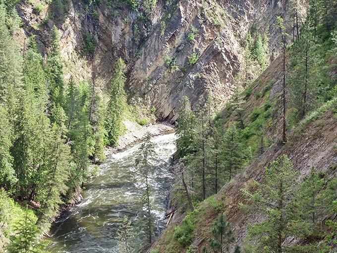The Moyie River carves its determined path through the canyon, a testament to water's patient persistence over countless millennia.