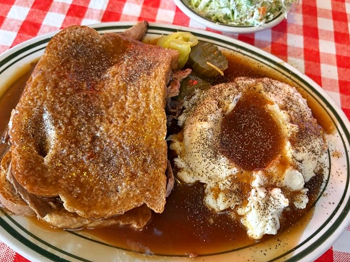 A roast beef sandwich that means business. Tender meat swimming in savory gravy atop mashed potatoes&mdash;carb-counters beware, resistance is futile.